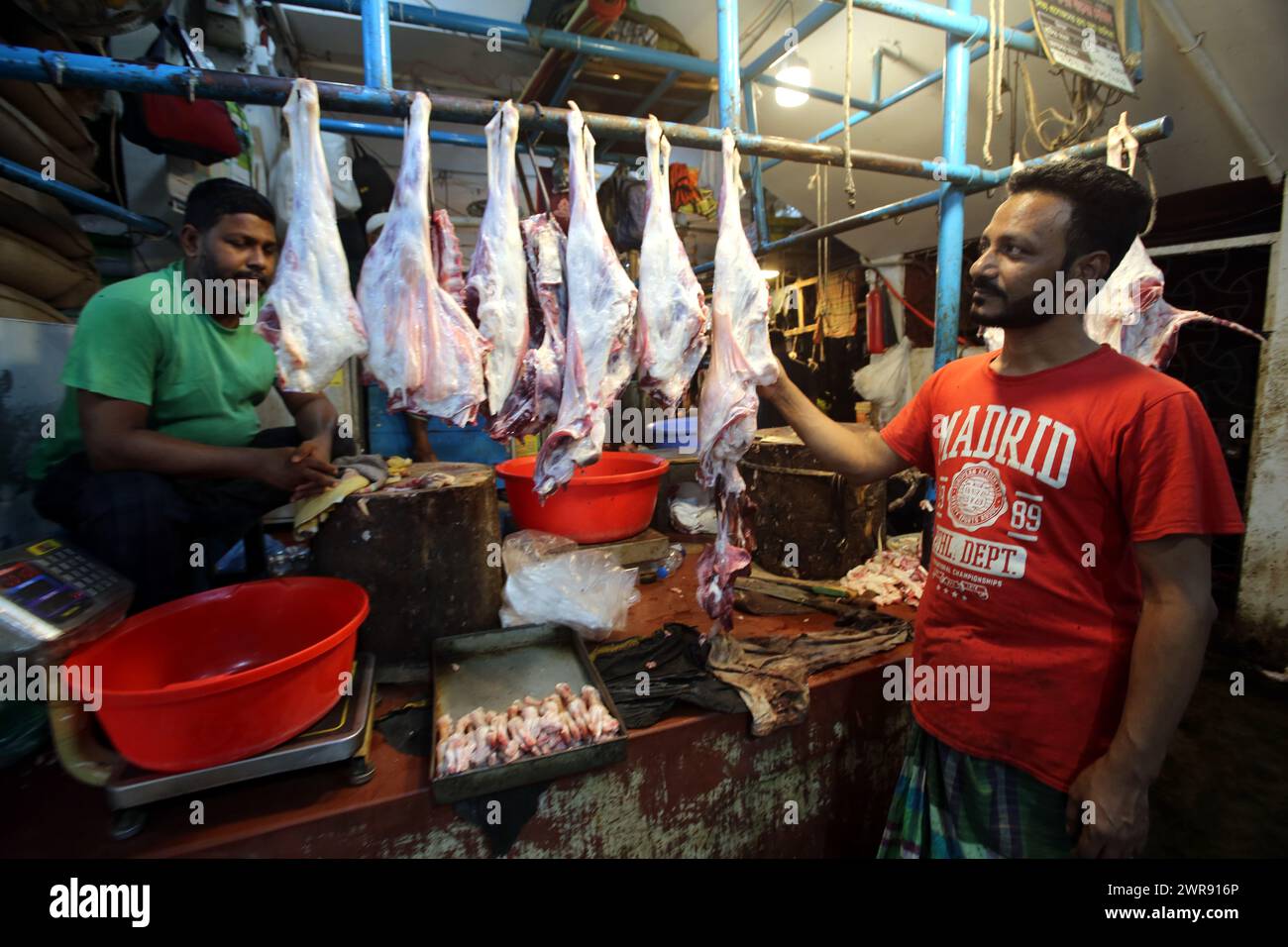 Dhaka, Wari, Bangladesh. 11th Mar, 2024. shopkeepers have arranged fish, Chicken and meat for ...