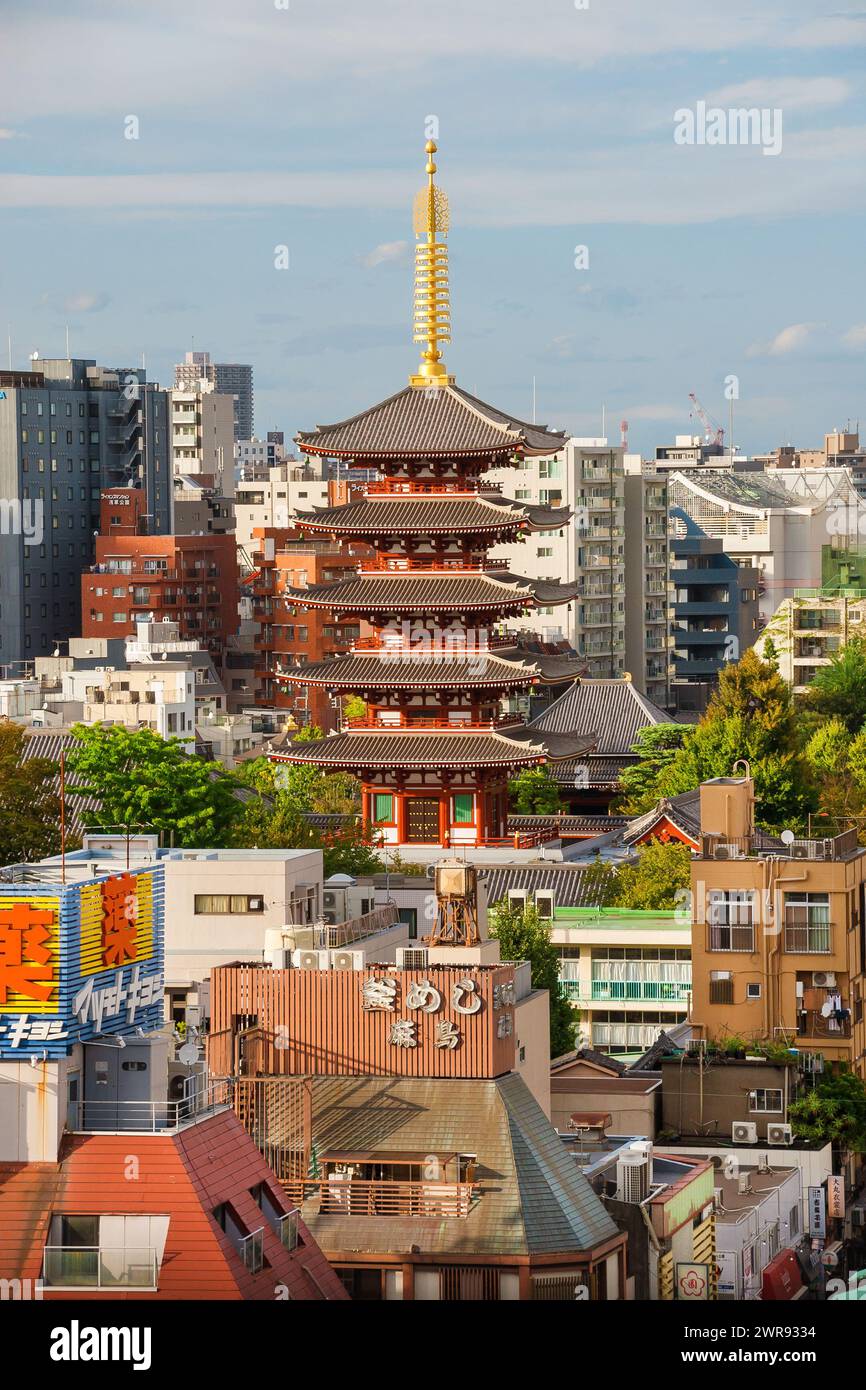 Japan between tradition and modernity. Ancient Senso-ji beautiful pagoda in Asakusa surrounded ...