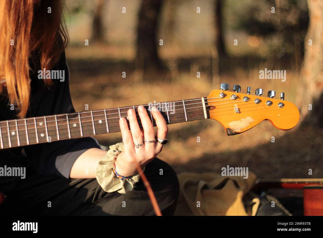 Delve into a harmonious fusion of music and nature as female hands ...