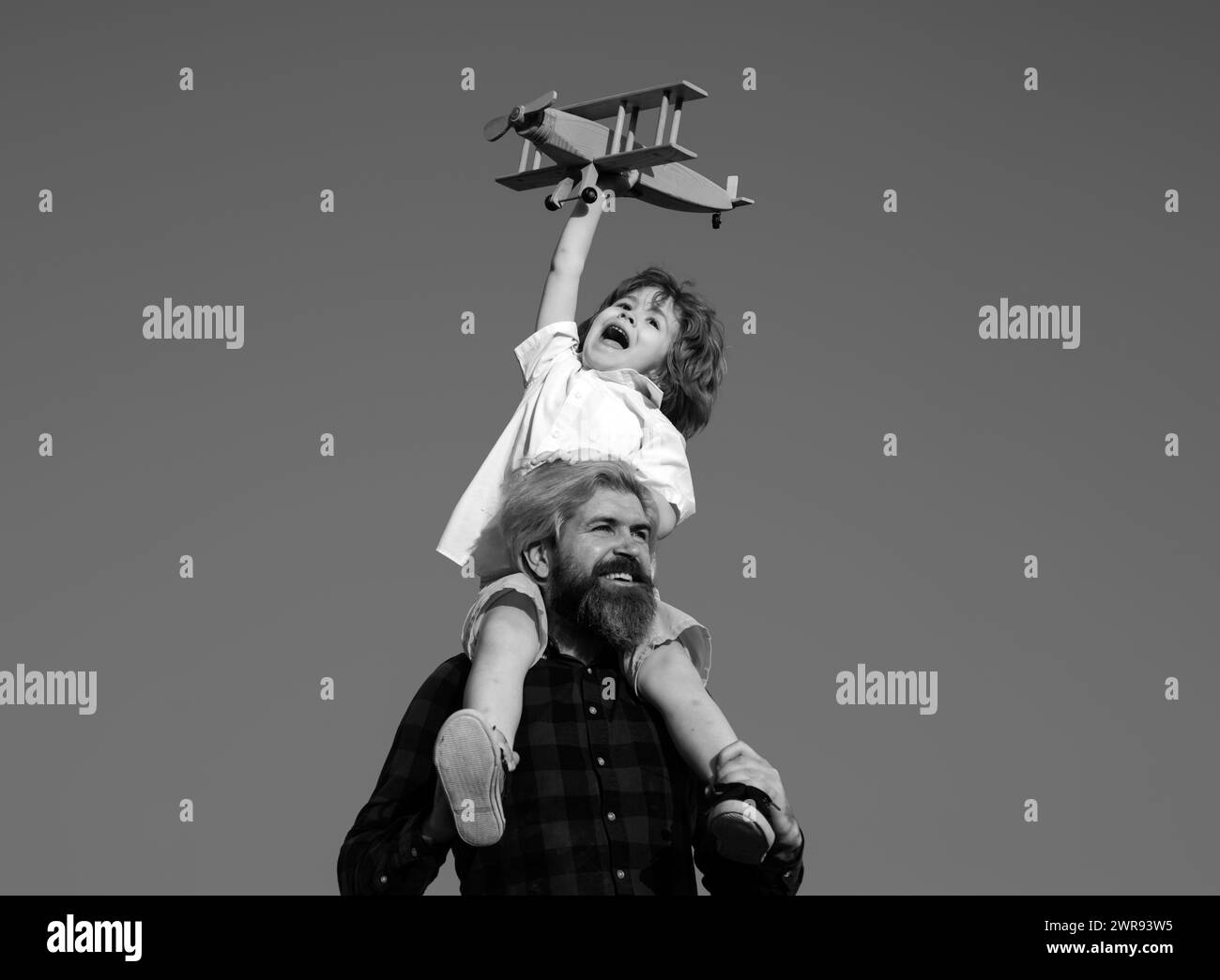 Kid boy pilot. Child son and dad with airplane Stock Photo - Alamy