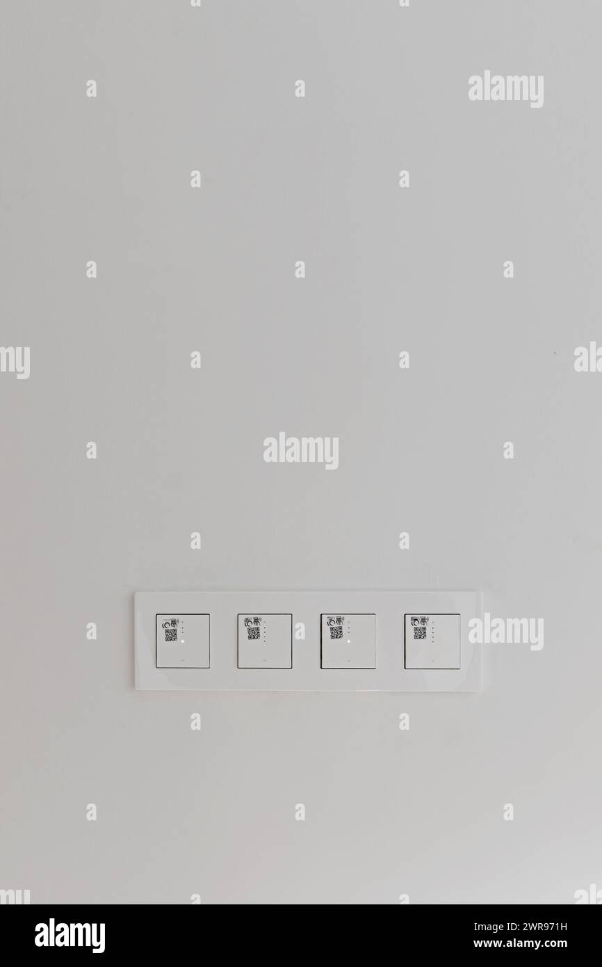 light switches with QR code to manage them from an app Stock Photo - Alamy