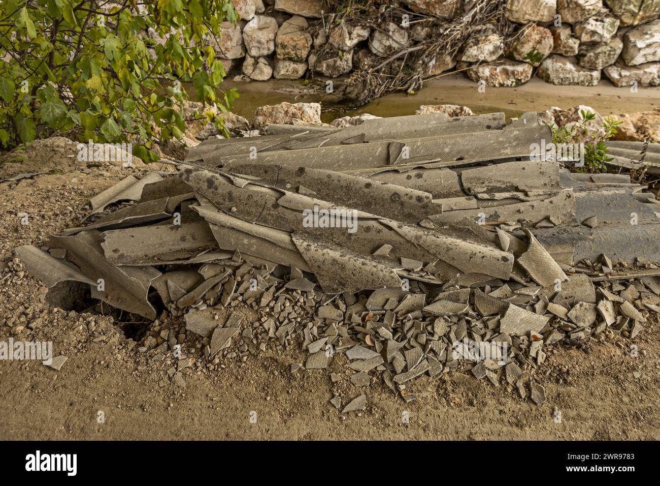 Remains of some uralite plates possibly made with asbestos lying in the ...