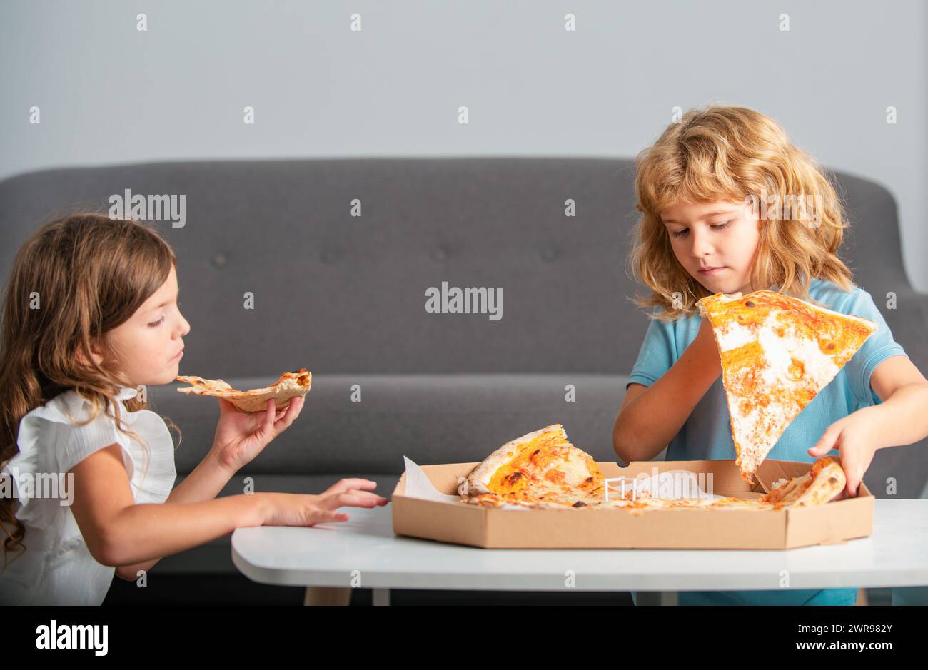 Pizza and kids, slices pizza in kids hand. Children eating tasty fast ...