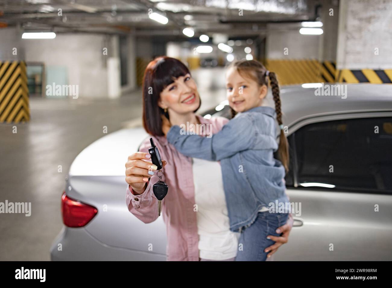 Attractive mother and daughter prepared keys to open car for weekend ...
