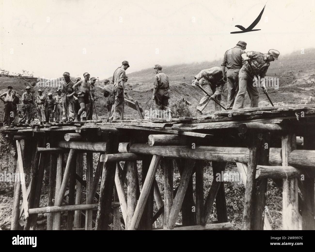 Engineers repair a bridge, Engineers repair a bridge destroyed by the ...