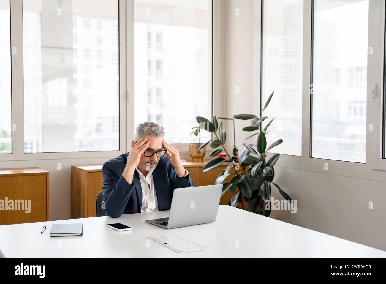 Worried director looking phone screen hi-res stock photography and ...
