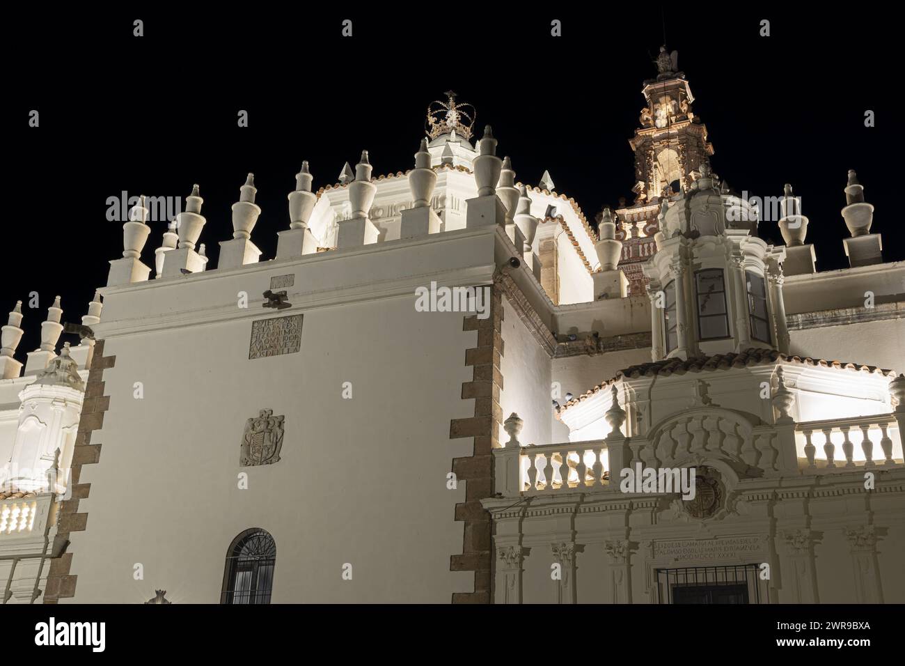 Elaborate architectural building illuminated at night Stock Photo - Alamy