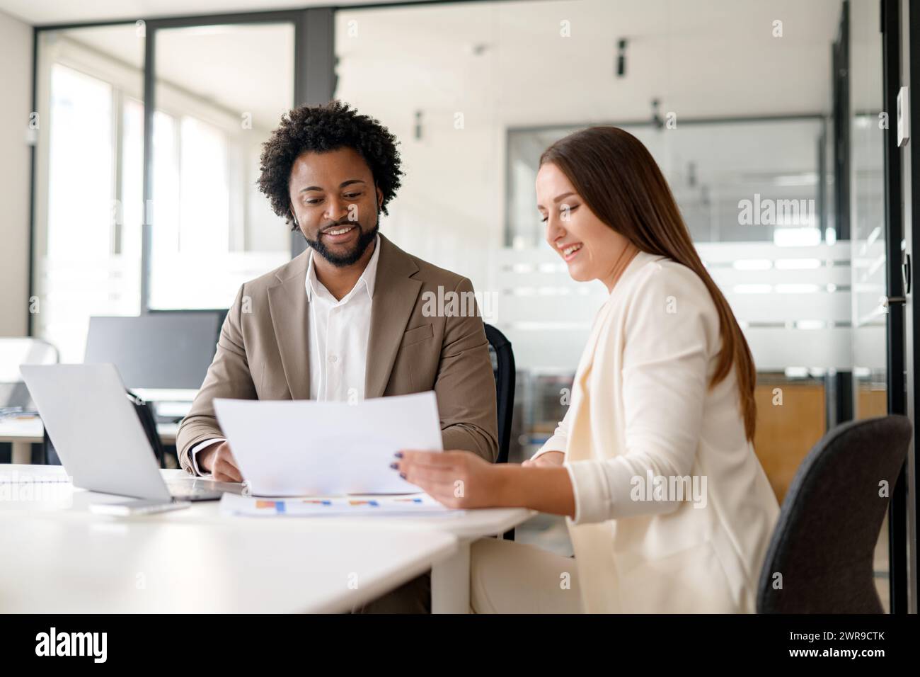 Two business colleagues engaging in a constructive discussion with a ...