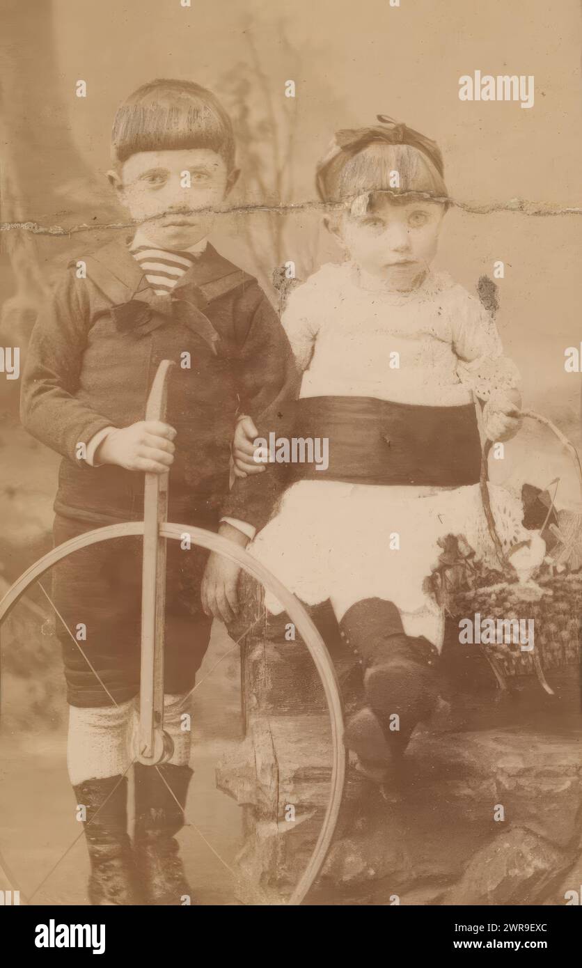 Portrait of a boy and girl with toys, This photo is part of an album ...