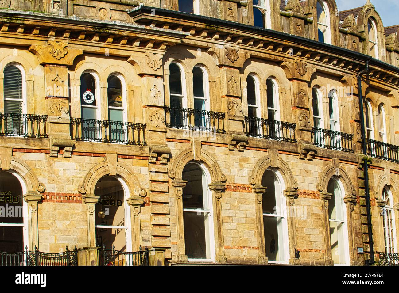 Vintage brick building facade with ornate windows and architectural ...