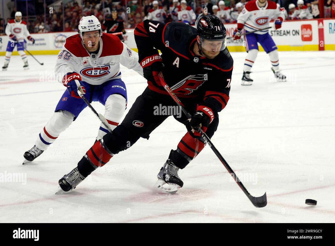 Carolina Hurricanes' Jaccob Slavin (74) controls the puck with Montreal ...