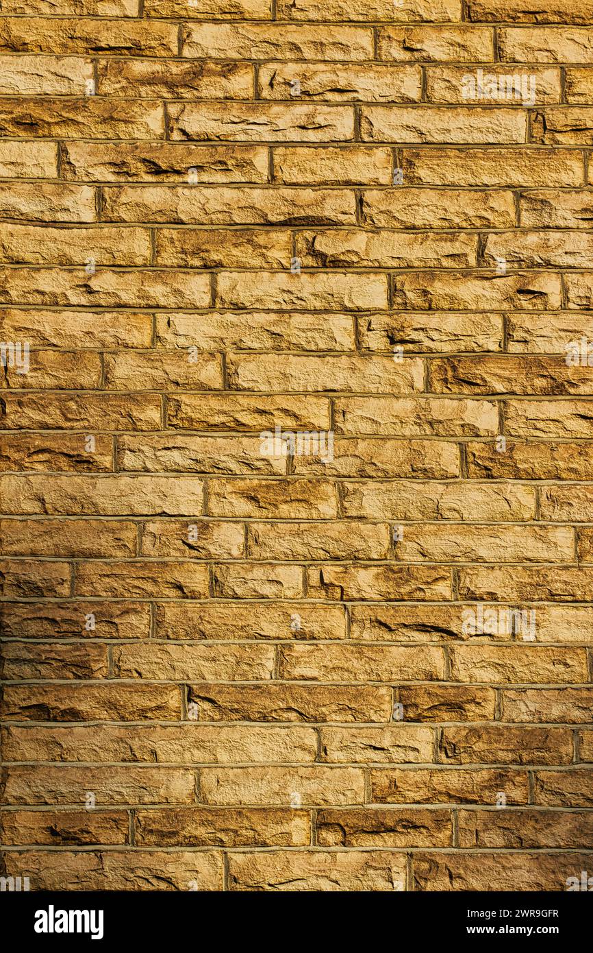 Seamless texture of a yellow brick wall, perfect for background or ...