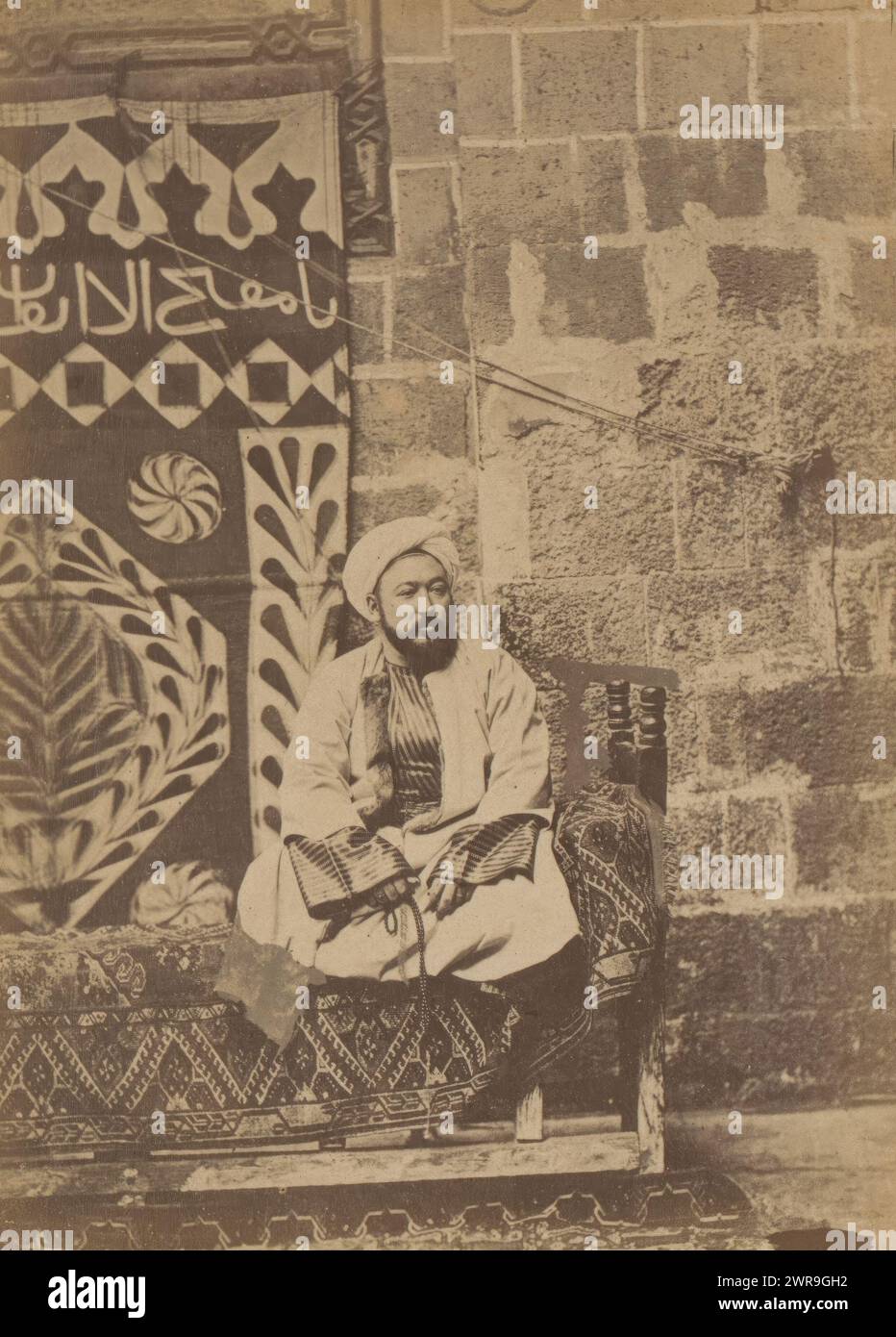 Seated Egyptian man on a divan, This photo is part of an album ...