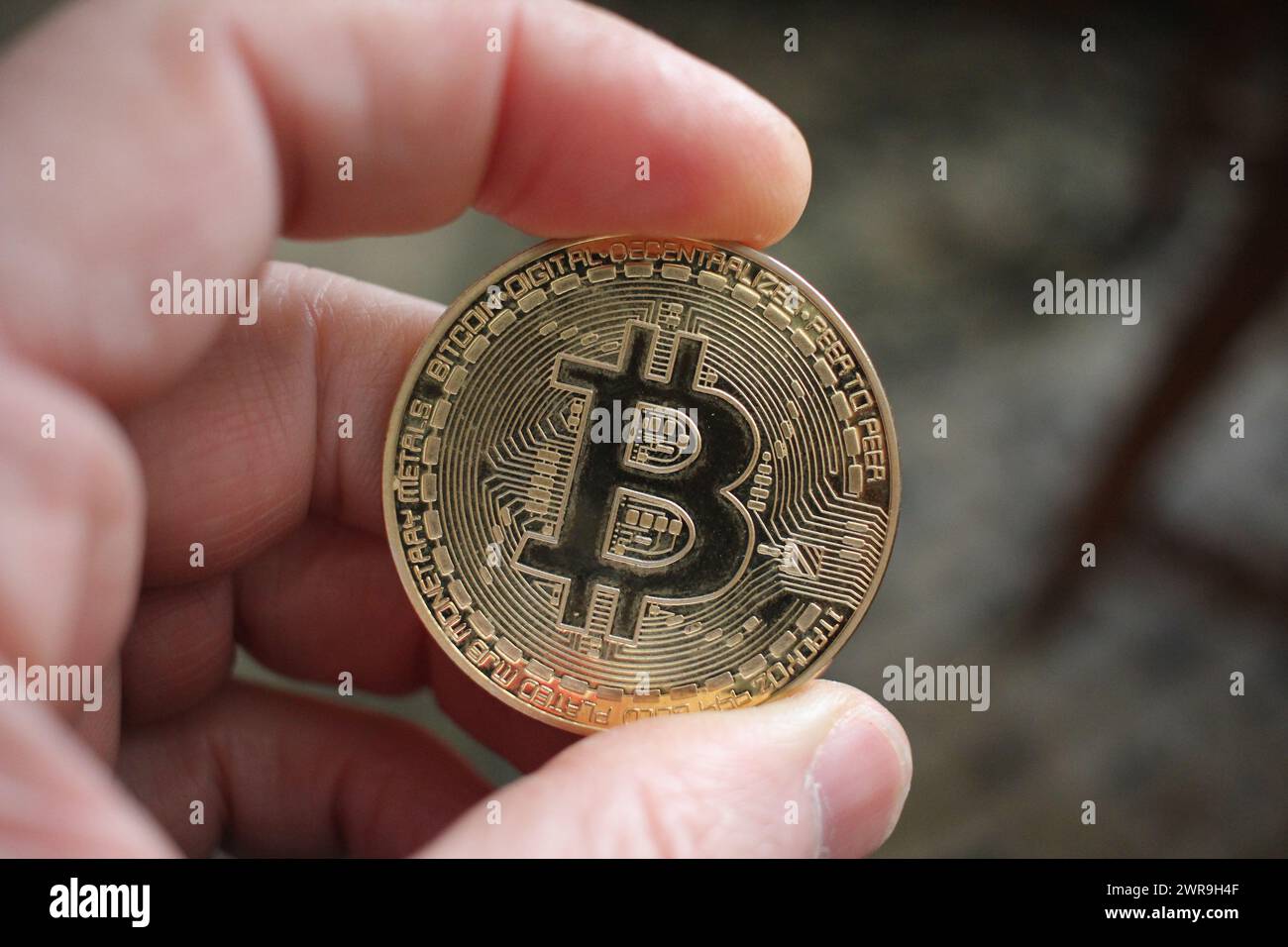 touching a symbol with my fingers, a bitcoin, the digital money Stock ...