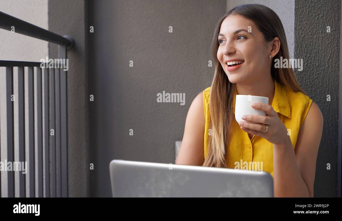 Young woman working from home balcony hi-res stock photography and ...