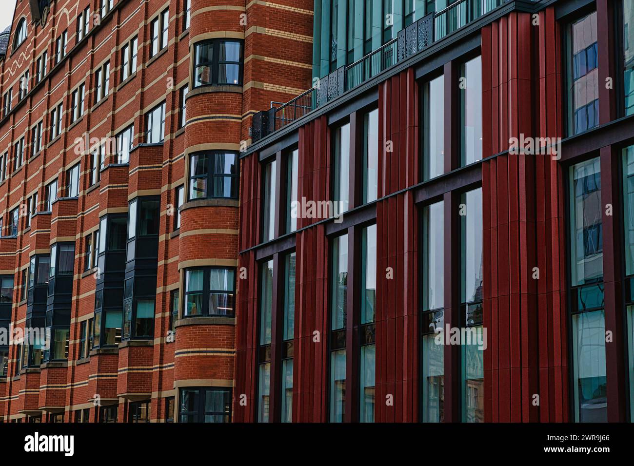 Modern building facade with a pattern of red and brown rectangular ...