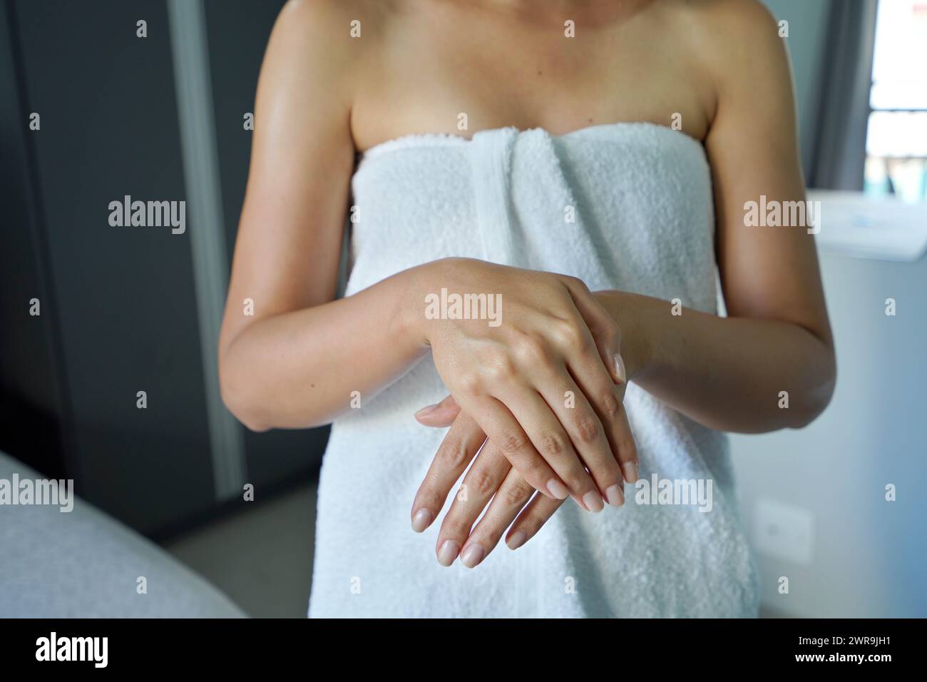 Girl shows her moisturized hands with nails done. Unidentified woman ...