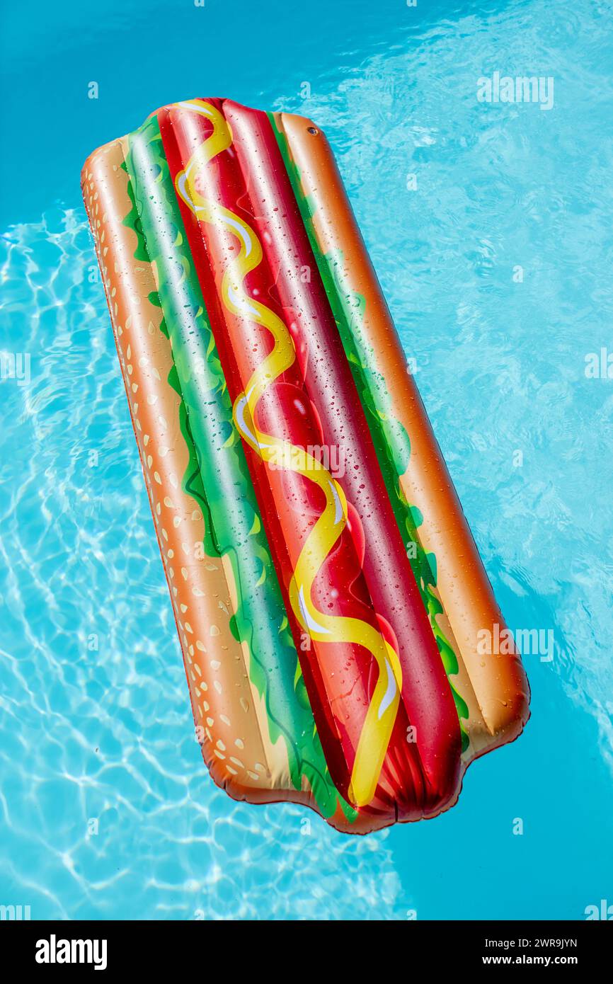Hot dog inflatable in swimming pool Stock Photo - Alamy