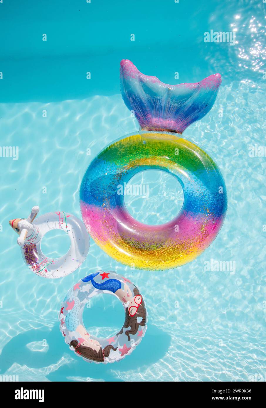 Group of inflatables in the swimming pool Stock Photo - Alamy
