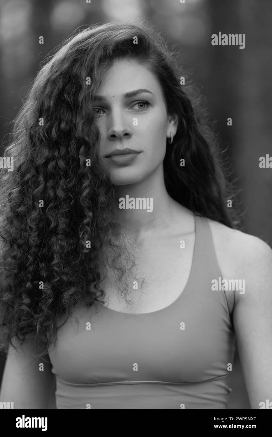 Young, beautiful skinny brunette posing in a forest grove. Young ...