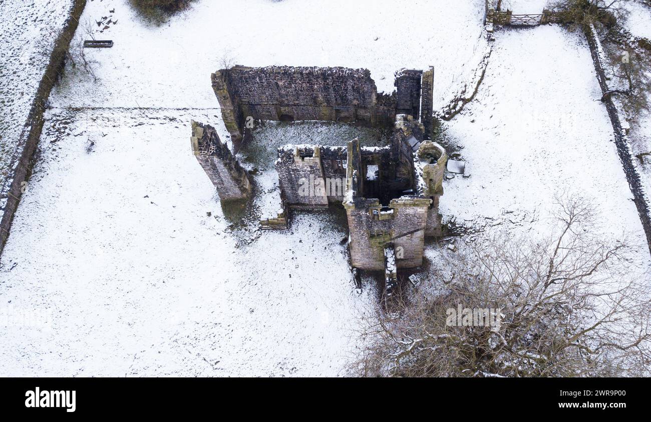 26/02/120 After overnight snowfall a walker explores Throwley Old Hall ...
