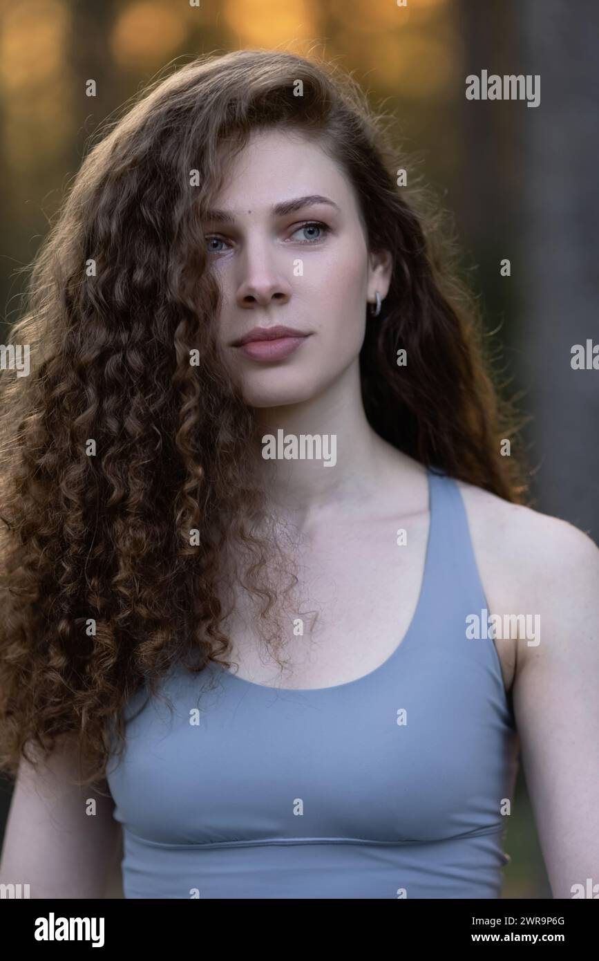 Young, beautiful skinny brunette posing in a forest grove. Young ...