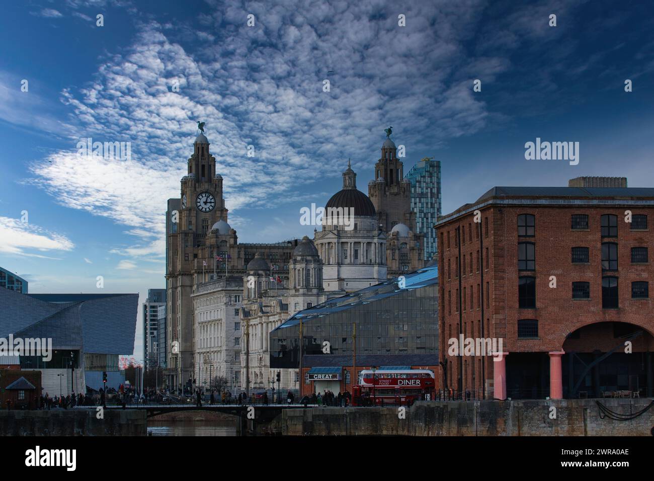 Dramatic sky over historic city buildings with modern architecture in ...