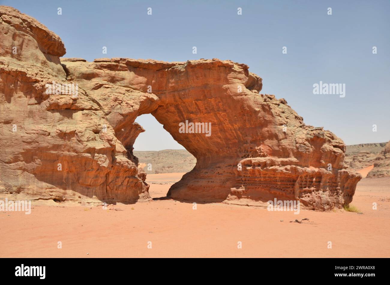 Rock formation with an erosive window in the Sahara desert, Algeria ...