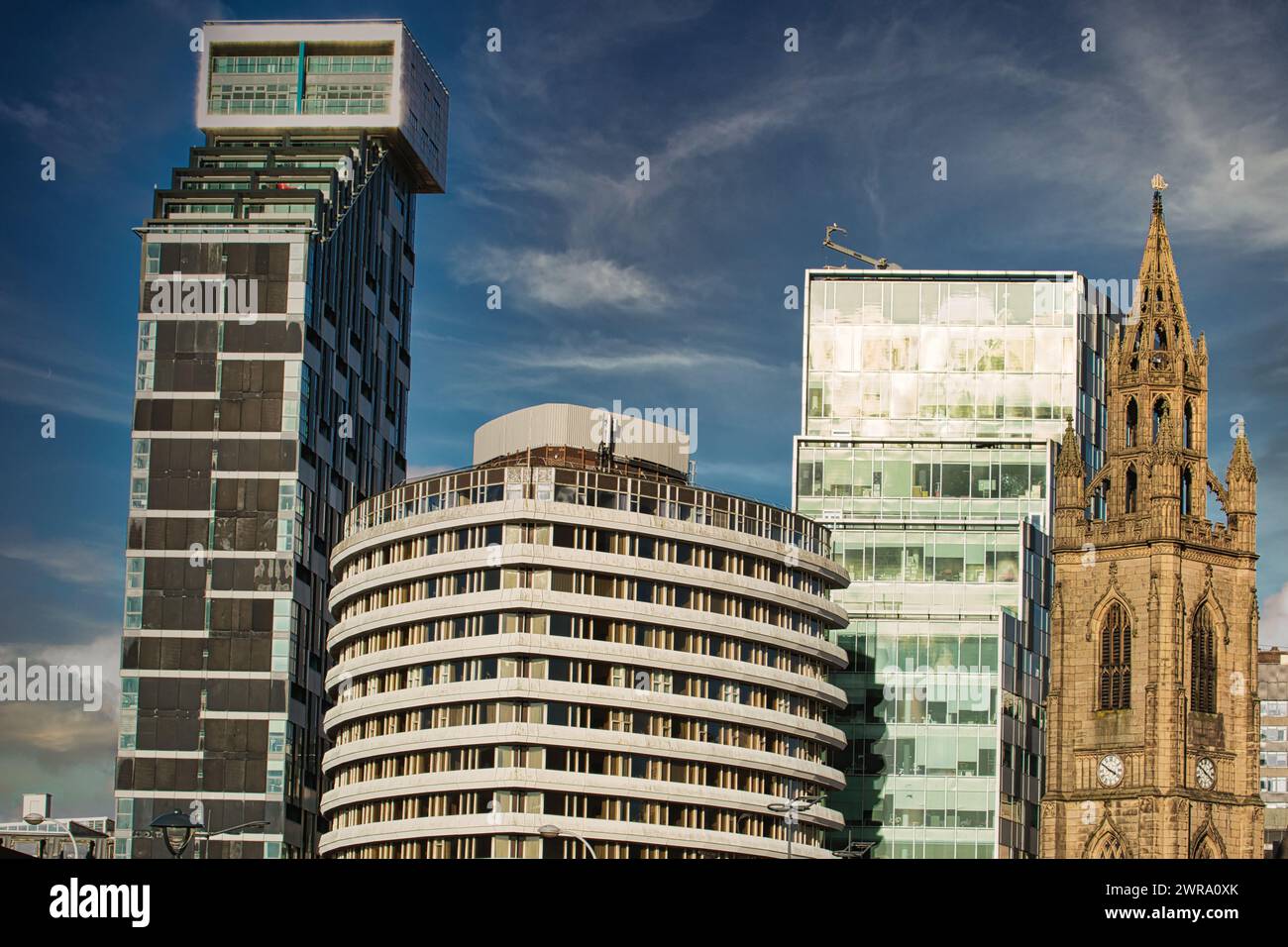 Modern city skyline with a mix of contemporary buildings and a historic ...