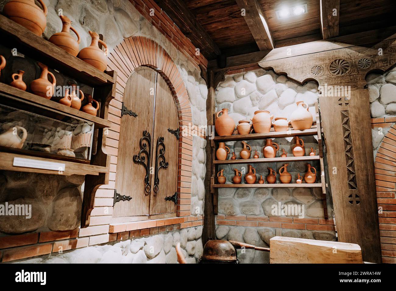 Traditional old wine cellar with handmade craft clay jugs.Antique ...