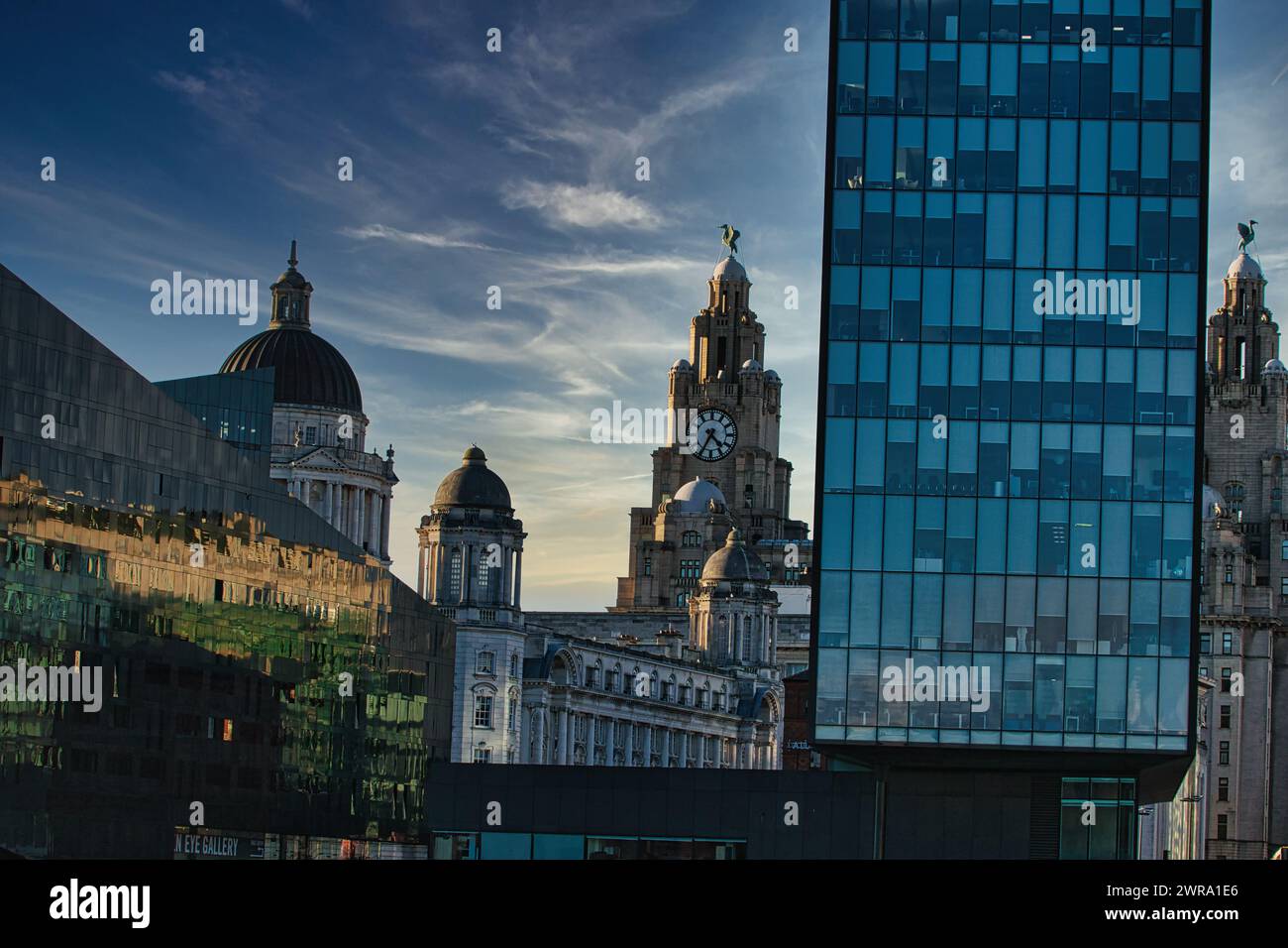 Contrast of old and new architecture with historic domes beside a ...