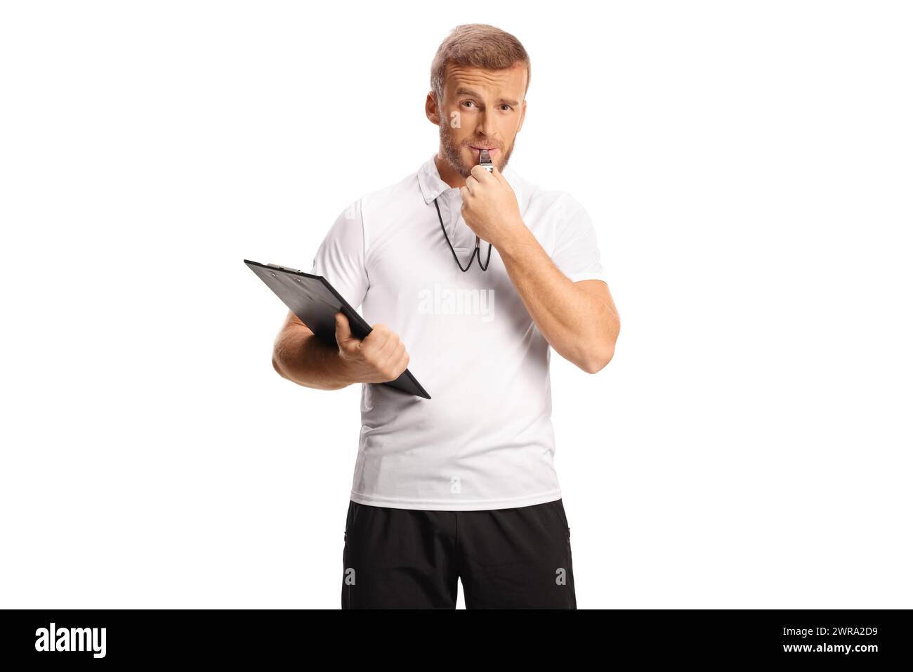 Sports coach holding a clipboard and blowing a whistle isolated on ...