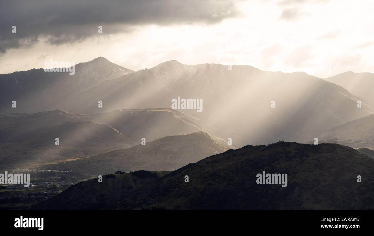 Beautiful landscape with multiple layers of mountains lit by warm and ...