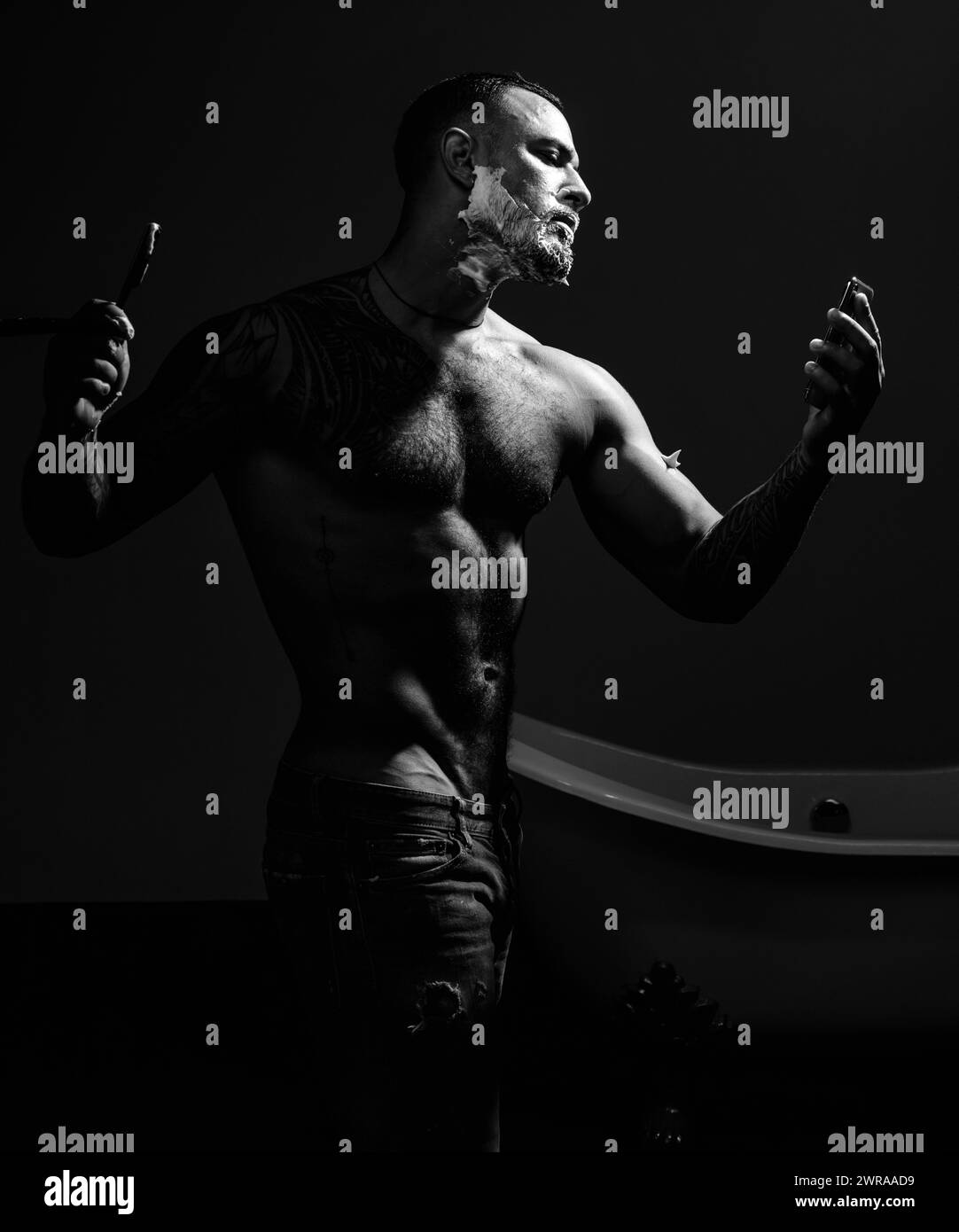 Hairdressers work for a handsome guy at the barber shop. Man visiting ...