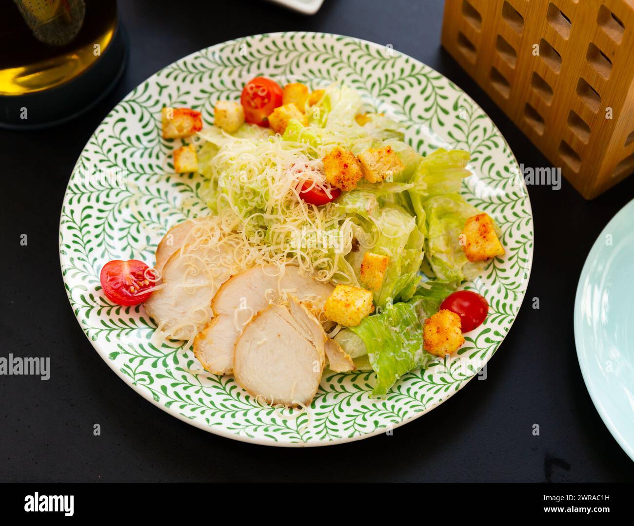 Caesar salad with chicken on circular plate Stock Photo - Alamy