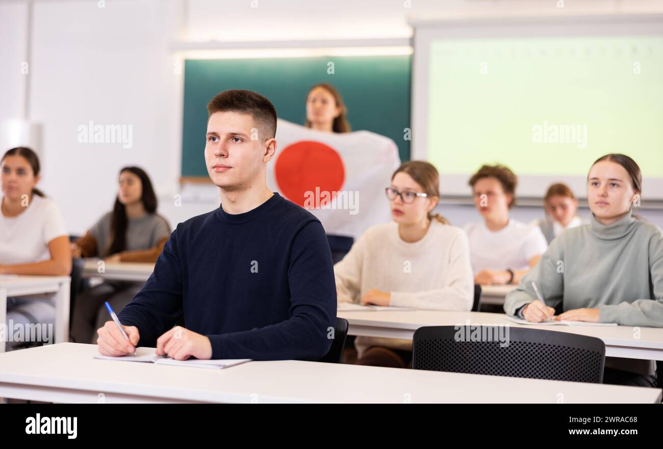 Young boy student studying diligently at school Stock Photo - Alamy