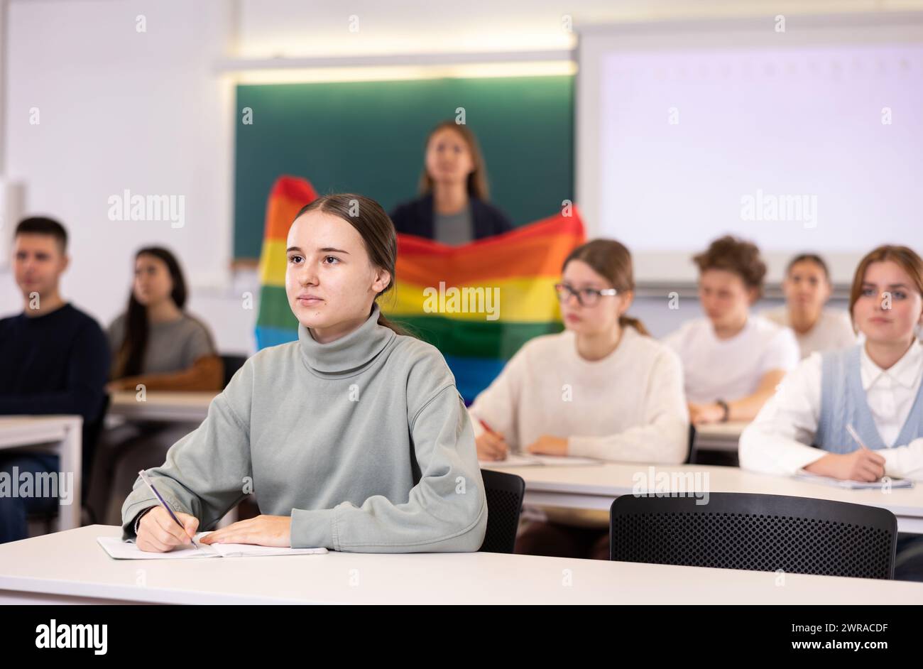 Teacher explaining meaning of LGBT flag to students Stock Photo - Alamy