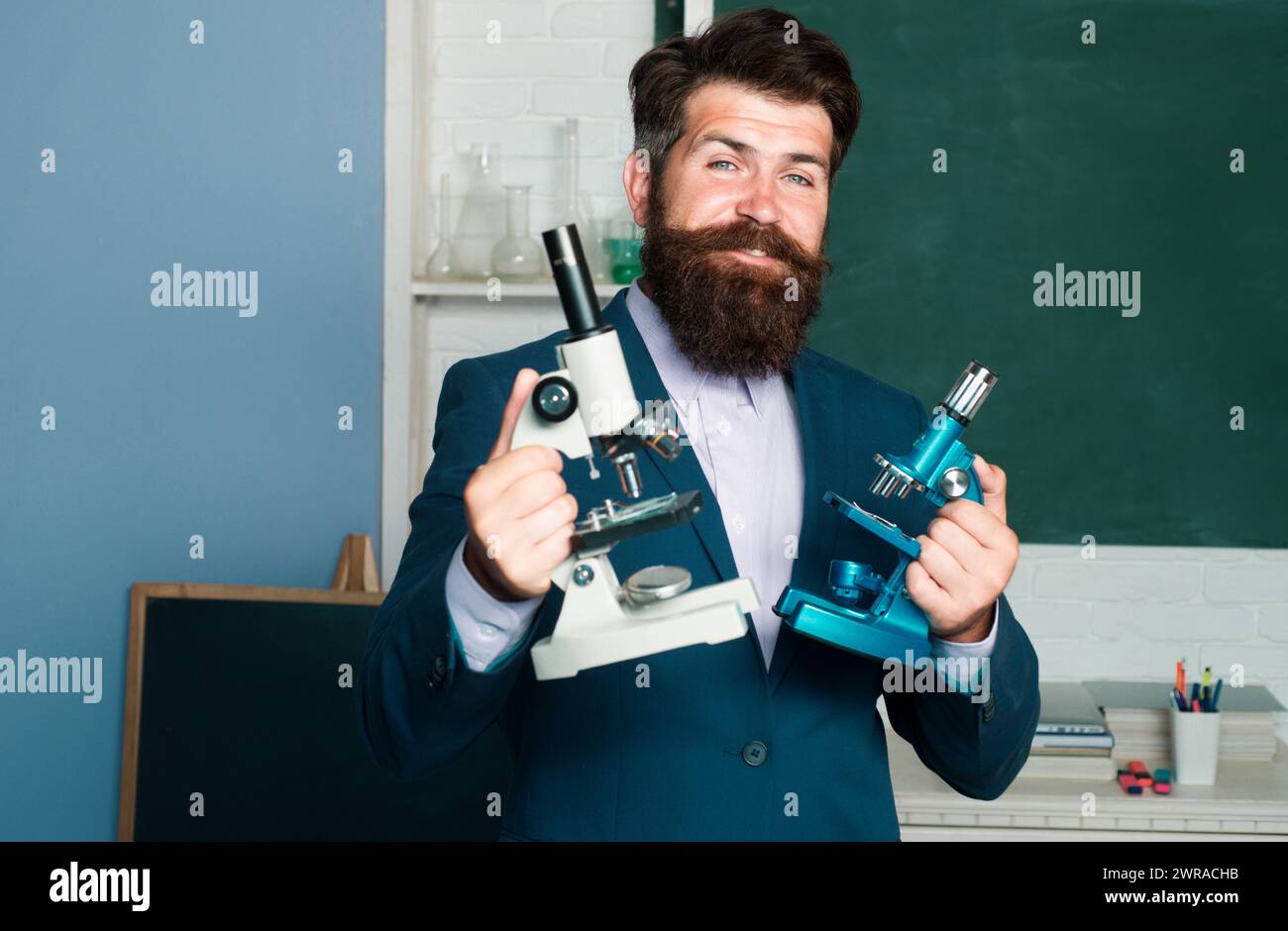 Portrait of teacher man with microscope, professor, tutor, mentor in ...