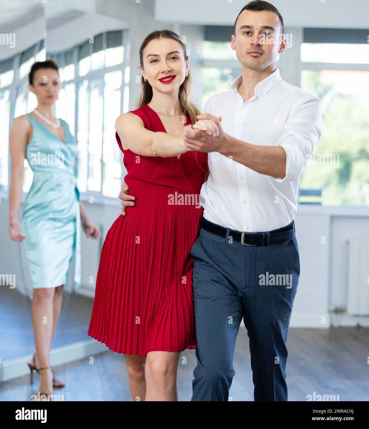Graceful duet dancing passionate tango during dance class Stock Photo ...