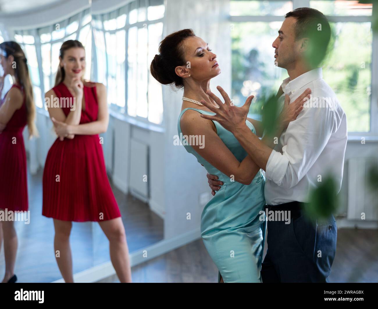 Coach, paired with man student, shows master class and explains ...