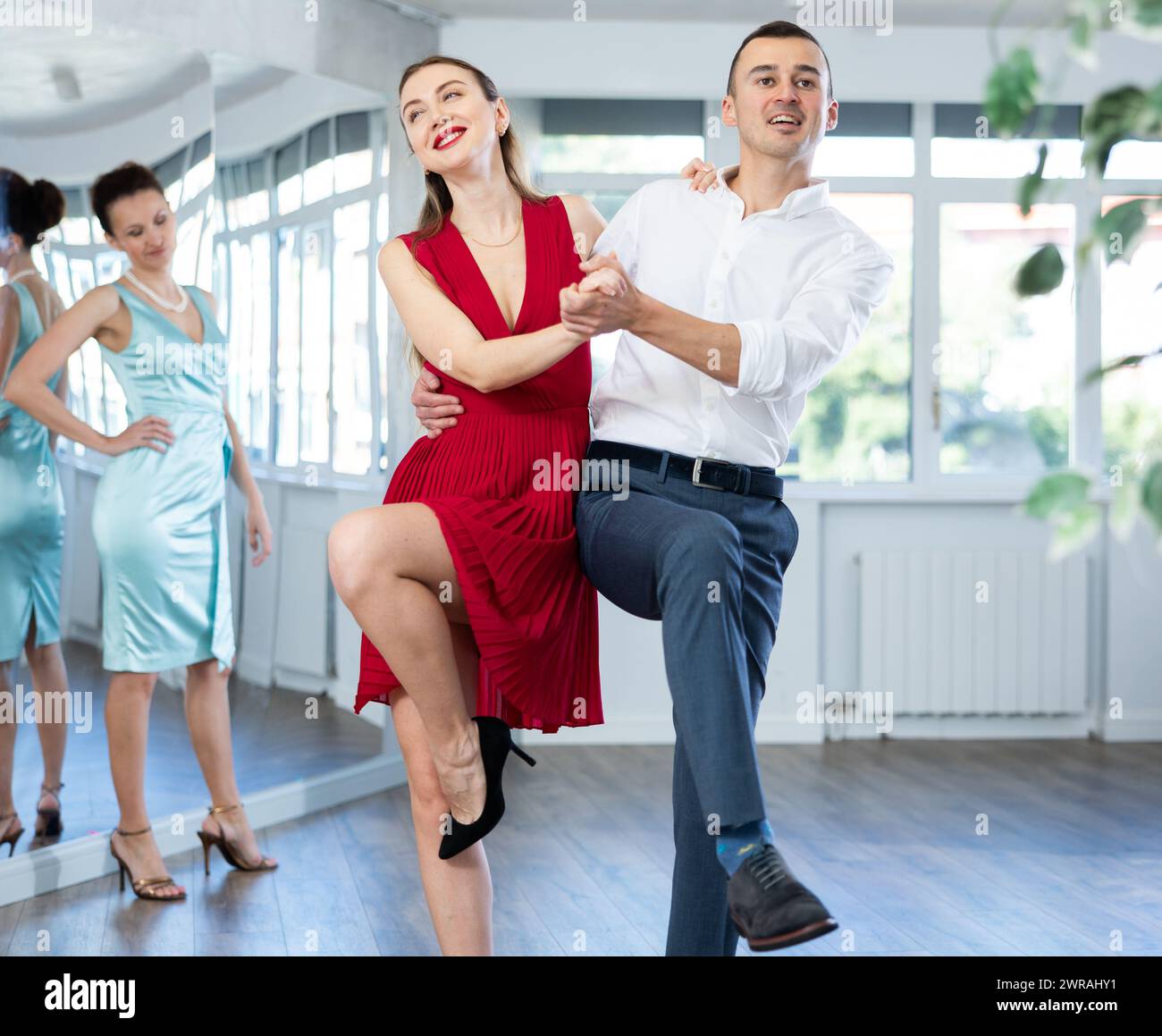 Couple in stage costumes learns boogie woogie dancing during individual ...