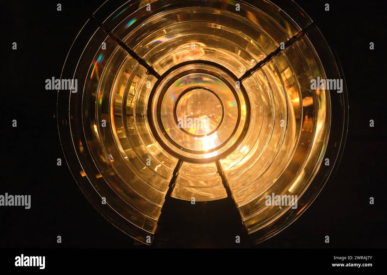 Close image of the glass prism making up Fresnel lens with lights on ...