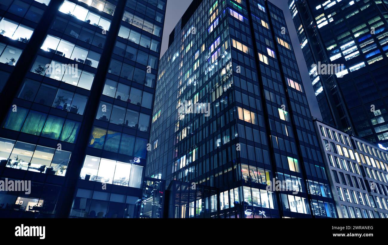 Office buildings by night. Night architectural, buildings with glass ...