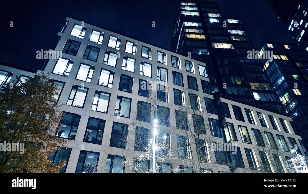 Office buildings by night. Night architectural, buildings with glass ...