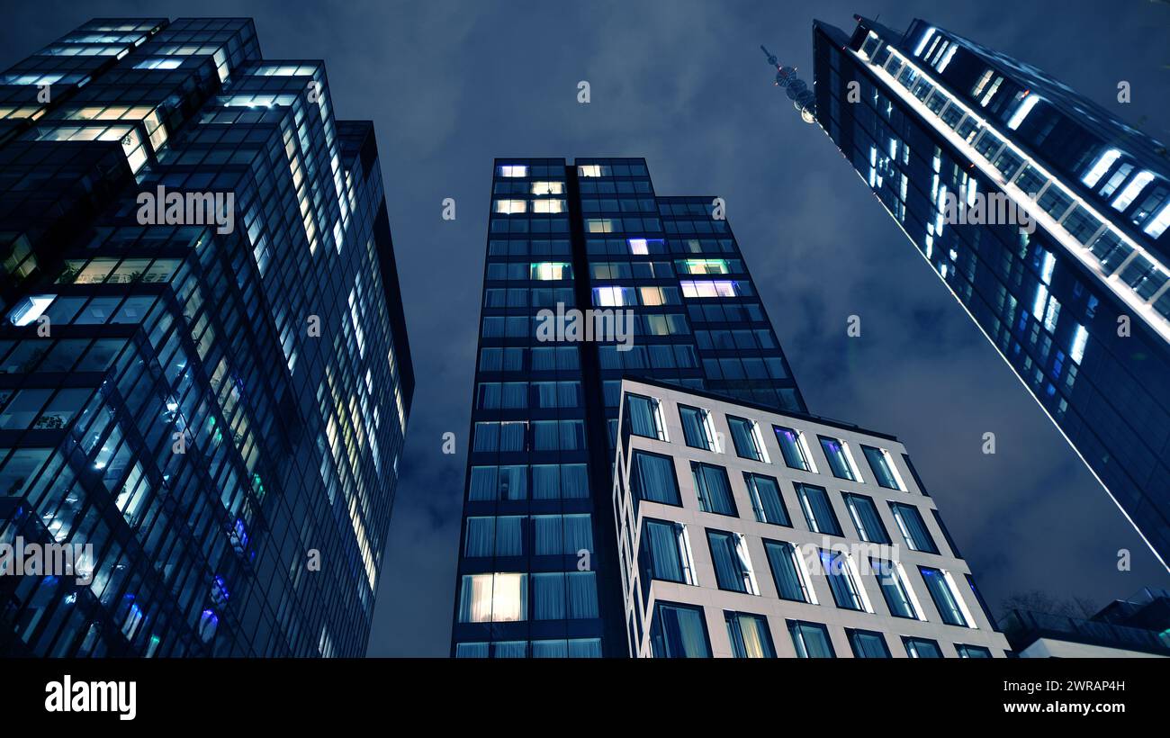 Office buildings by night. Night architectural, buildings with glass ...