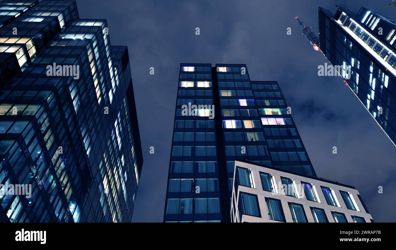 Office buildings by night. Night architectural, buildings with glass ...