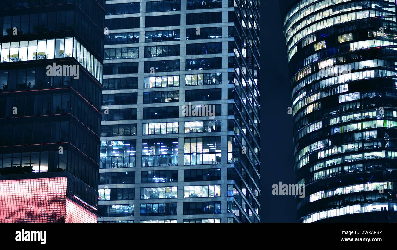 Office buildings by night. Night architectural, buildings with glass ...