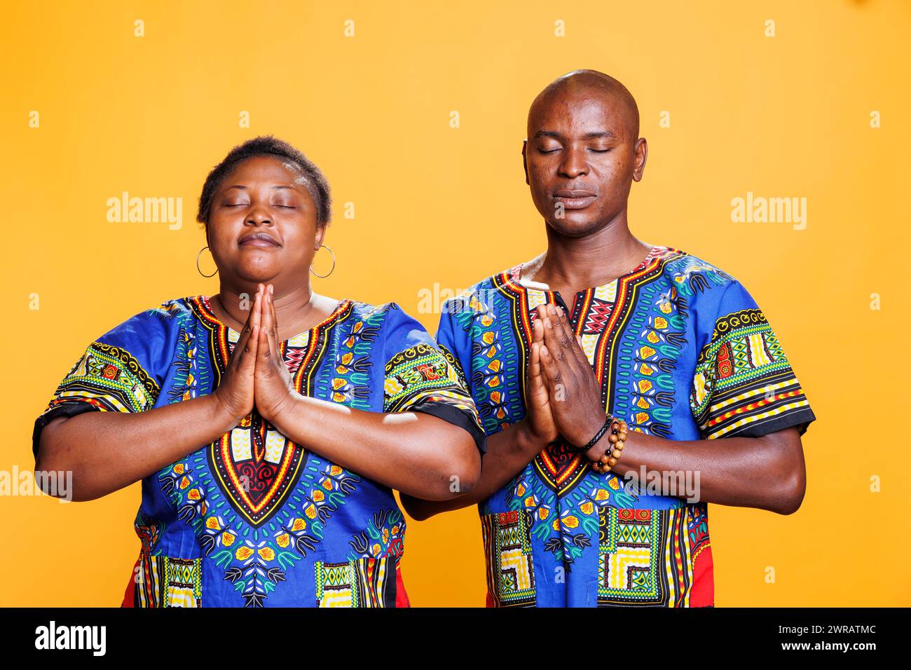 African american relaxed man and woman practicing breathing meditation ...