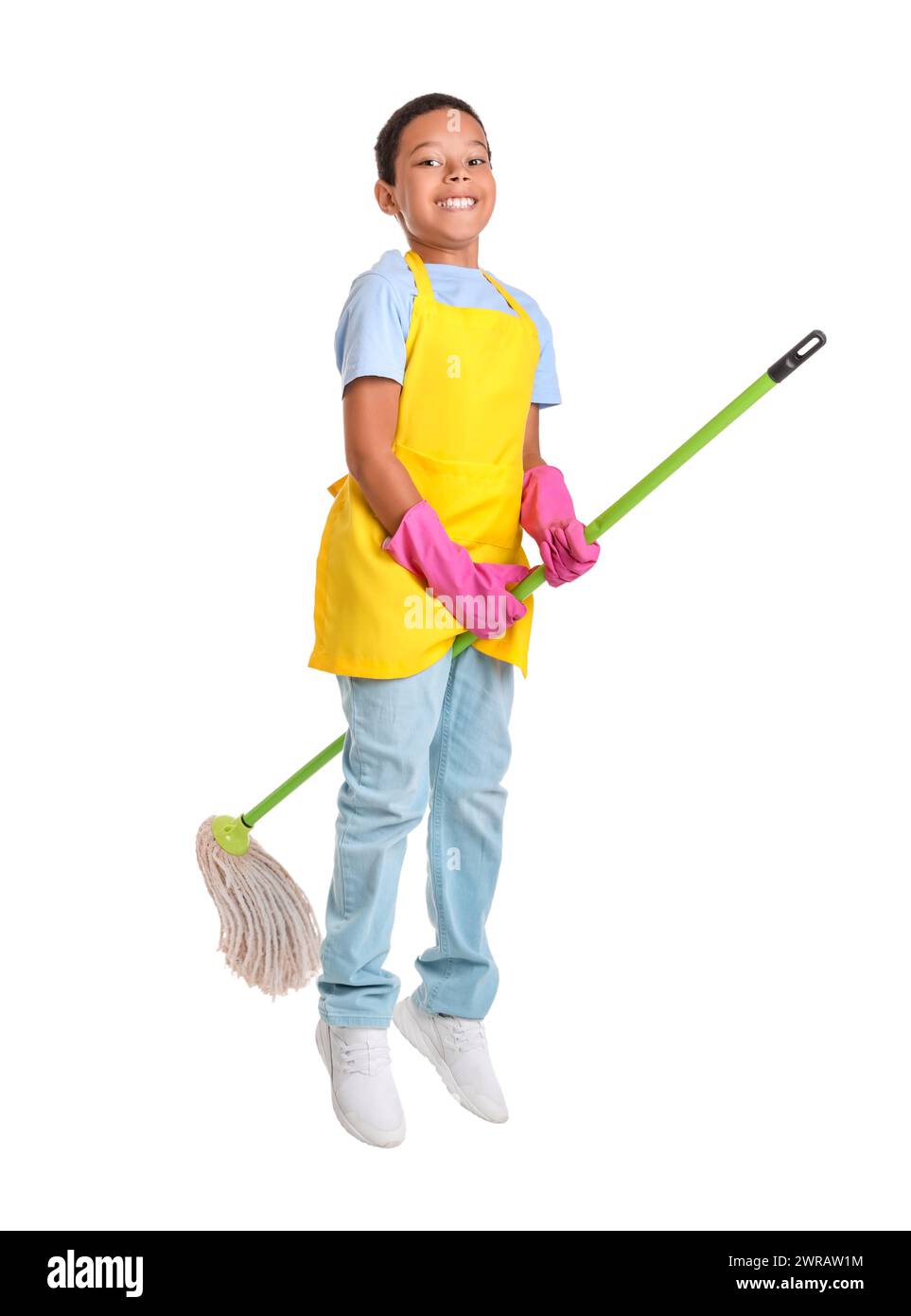 Cute little African-American boy with mop jumping on white background ...