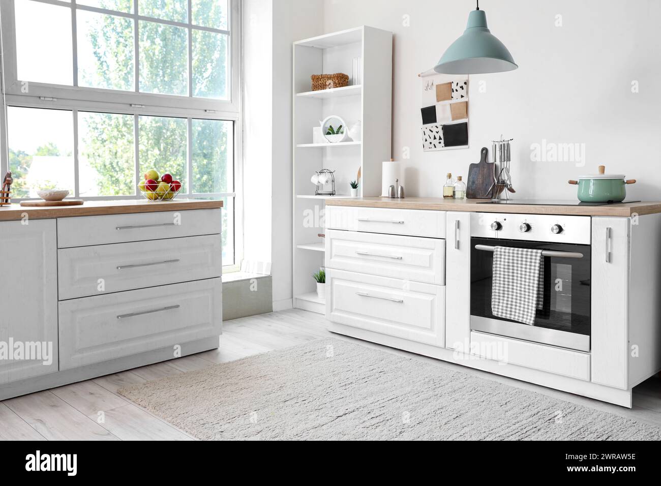 Interior of kitchen with white counters and oven Stock Photo - Alamy